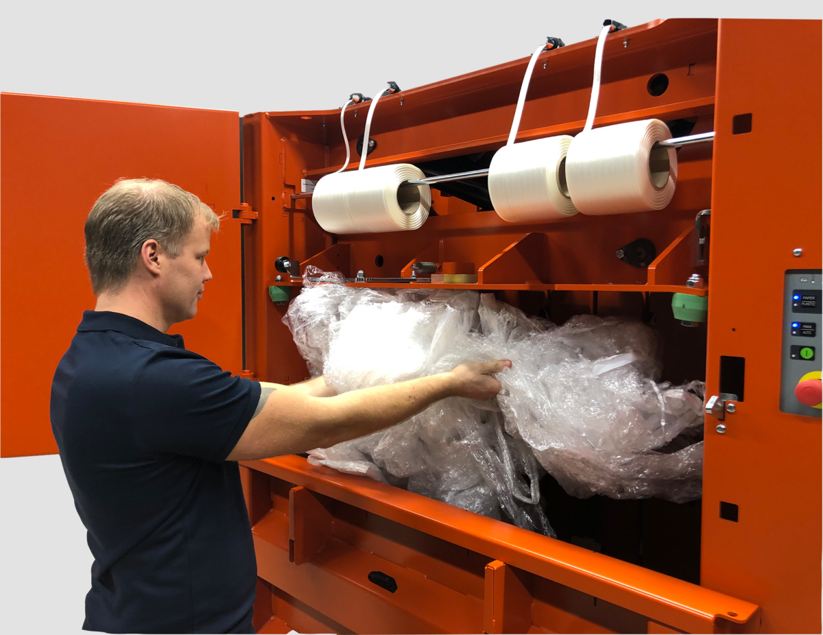 Extra low-built baler compacts waste where space is limited - Orwak